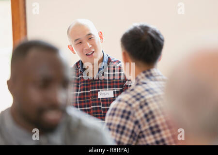 Men talking in group therapy Stock Photo - Alamy