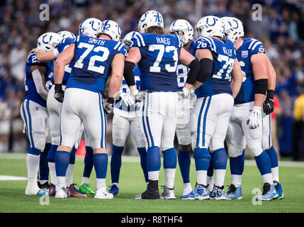 The Dallas Cowboys huddle during an NFL football game against the ...