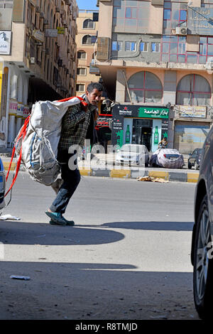 Cairo, Egypt - garbage recycling collector or Zabbaleen on a city ...