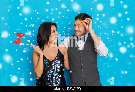 happy couple with party props having fun Stock Photo - Alamy