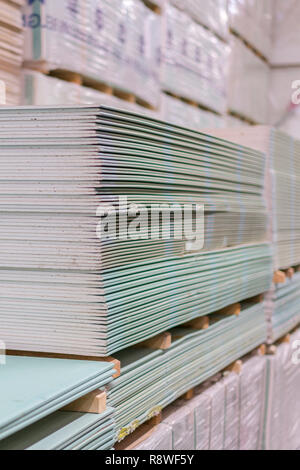 Gypsum plasterboard in the pack. The stack of gypsum board preparing ...