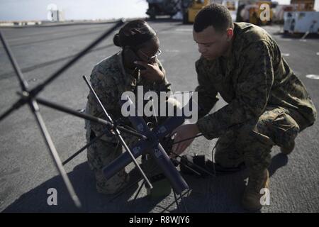 A U.S. Marine Corps AN/PRC-117G multiband-networking-manpack radio ...