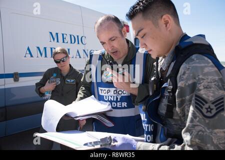 Airmen from the 60th Medical Group conduct an initial interview with a ...