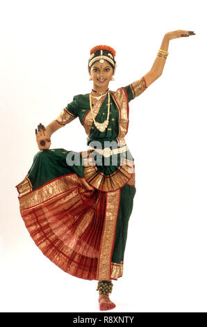 Full shot of Bharatnatyam dancer performing on stage - conept of ...