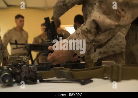 Royal Saudi Air Force service members assemble an American Joint Direct ...