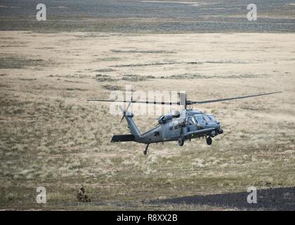 A 305th Rescue Squadron HH-60 and 79th Rescue Squadron HC-130J are ...