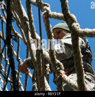 A U.S. Army soldier descends a rope obstacle on the Grabairz Confidence ...