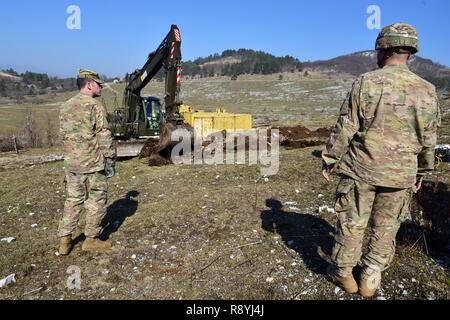 Soldiers with the US Army constructing a trench during World War I. The ...