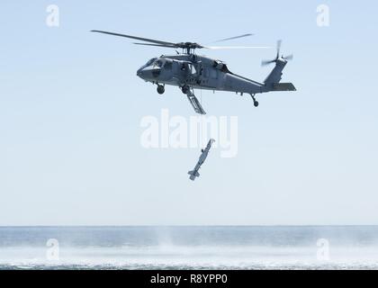 An Airborne Mine Neutralization System (AMNS) detonates in Pyramid Cove ...