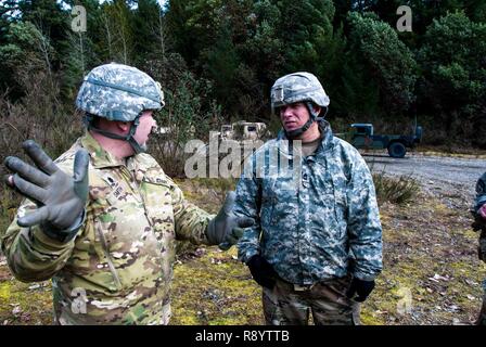 A Soldier with HHC 416th TEC ground guides an M1083 medium tactical ...