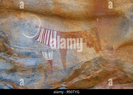Neolithic rock painting of a human figure apparently swimming or ...