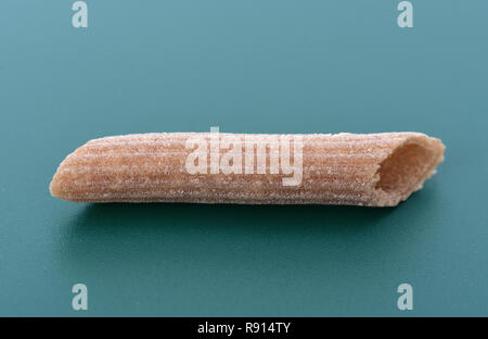 Buckwheat macaroni on green background Stock Photo - Alamy