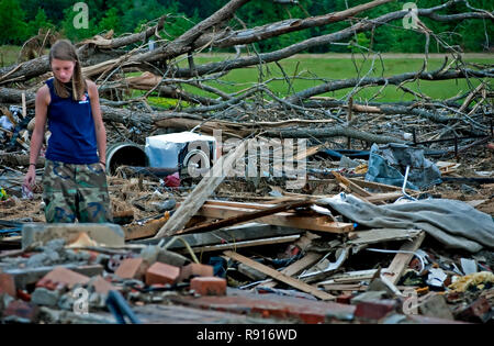 A girl sifts through the rubble of a demolished home, May 15, 2011 ...