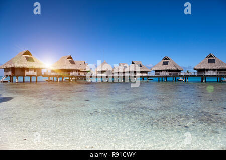 Typical Polynesian landscape -small houses on water Stock Photo - Alamy