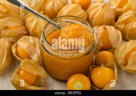 Golden berry, cape gooseberry jam in jar with golden berries from top ...