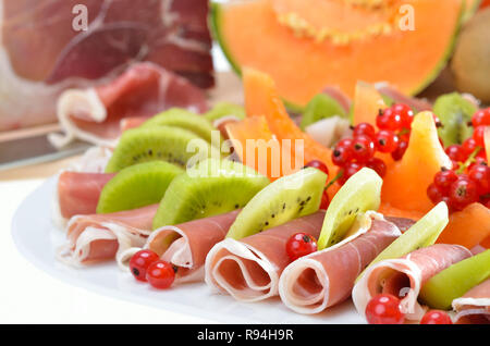 Fine Italian ham with fresh fruits Stock Photo - Alamy