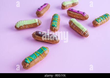 Traditional french eclairs with pink chocolate on white Stock Photo - Alamy