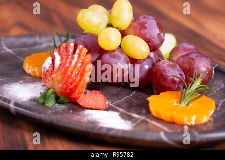 fruit plate. strawberry, grape, mandarin, orange, grapefruit, pineapple ...