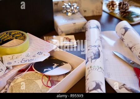 Gift-wrapping paper, scissors, sticky tape and decorations Stock Photo ...