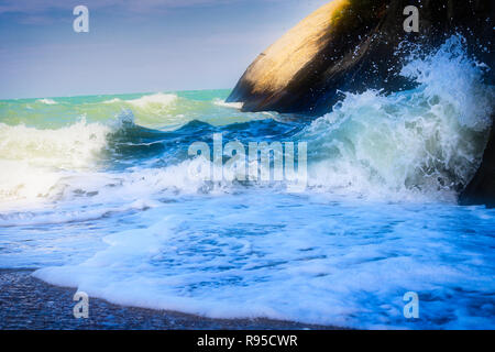 Sea surf, the blue wave hits the rocks. Coastline foam from breaking on ...