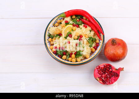 Eastern dish couscous with pomegranate and chickpeas Stock Photo - Alamy