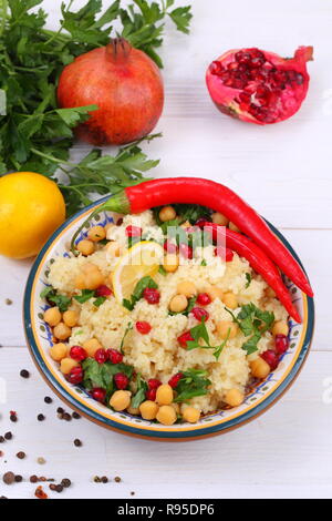 Eastern dish couscous with pomegranate and chickpeas Stock Photo - Alamy