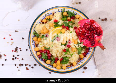 Eastern dish couscous with pomegranate and chickpeas Stock Photo - Alamy
