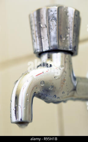A vertical shot of a water tap with the background of a ship Stock ...