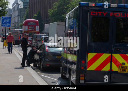 A City of London Police security checkpoint on Queen Victoria street ...
