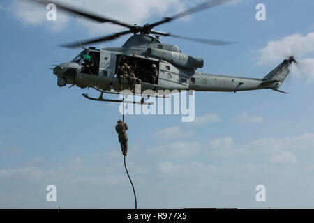 A Marine fast-ropes from a UH-1Y Venom helicopter during a fast-rope ...