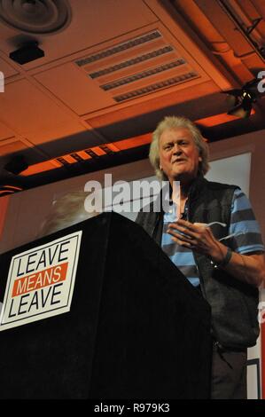 Wetherspoons owner businessman Tim Martin watches Nigel Farage speak at ...