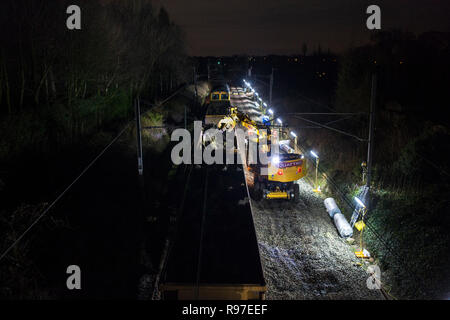Network Rail track renewal under way during a night time possession on ...