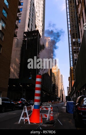 A steam tube on the street on midtown Manhattan, New York city, USA ...