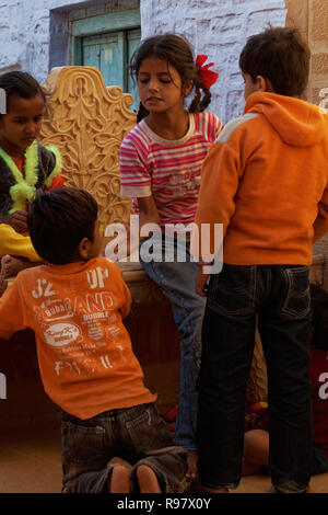 Older sister teaching siblings Stock Photo - Alamy