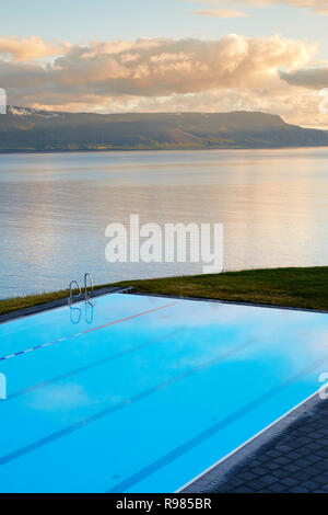 The swimming pool in Hofsós, Iceland, is almost hidden when looked at ...
