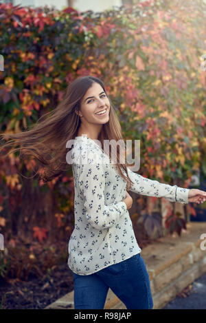 Surprised happy young woman in eyeglasses expresses shock, keeps hands ...