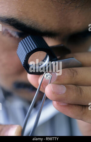 Diamond Checking with eye glass Stock Photo - Alamy