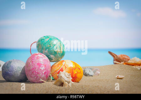 Easter on beach background. Eggs on the sandy by the ocean. Vacation ...