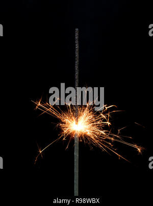 Sparkler isolated on a solid black background Stock Photo - Alamy