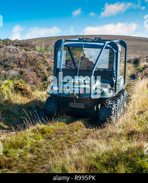 An Argocat multi-wheel all-terrain vehicle working high in The Scottish ...