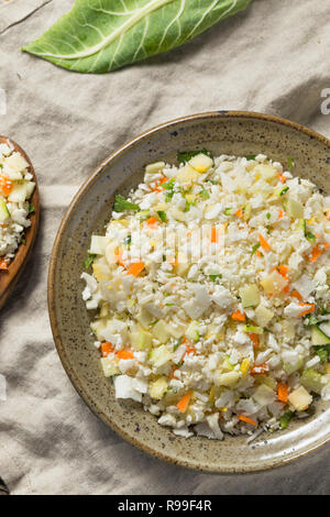 Organic Raw Cauliflower Rice in a Bowl, low angle view Stock Photo - Alamy