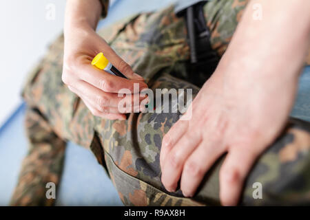 German soldier injections a morphin auto injector Stock Photo - Alamy