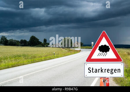 Attention heavy rain sign Stock Photo - Alamy