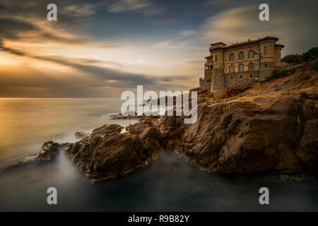 Boccale Castle on rocky coastline near Livorno at sunset, Italy Stock ...