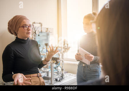 Group of young students in technical vocational training with young ...