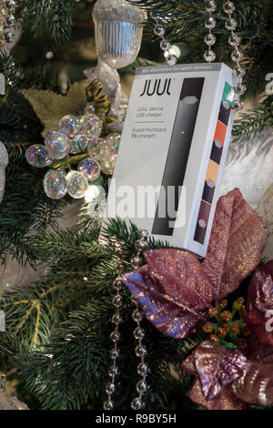 Box holding JUUL nicotine dispenser and pods on Christmas tree Stock ...