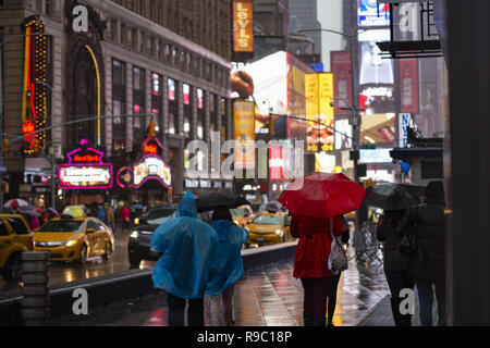 A rainy day in the Times Square area of Manhattan around 42nd Street ...