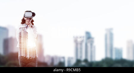 Woman in mask against sunrise above city trying virtual reality Stock ...