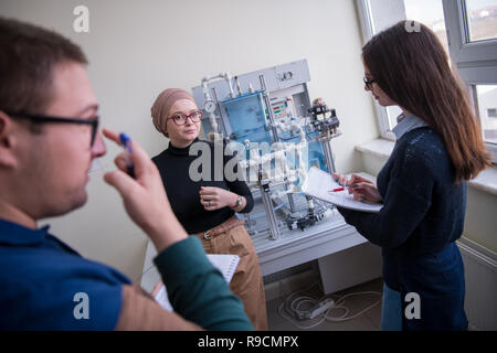 Group of young students in technical vocational training with young ...
