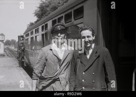 1950s historical, a train driver in cabin talks to the maitre d' of the ...